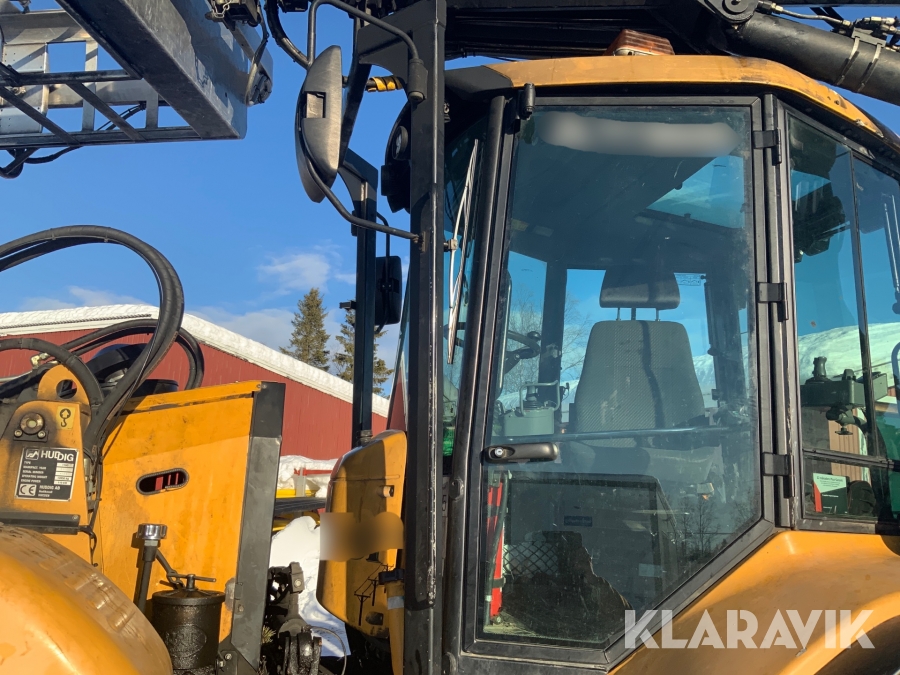 Traktorgrävare linjemaskin Huddig 1160D Med personkorg