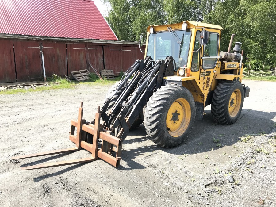 Lastmaskin med skopa & gafflar