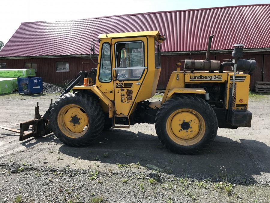 Lastmaskin med skopa & gafflar